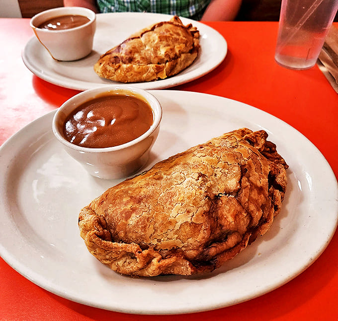 Golden-brown perfection! This Cornish pasty's flaky exterior gives way to a savory filling that would make any Cornish miner proud.