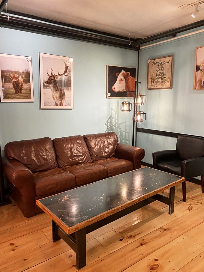 A comfy leather couch and Vermont wildlife photos create the perfect spot for contemplating life's big questions&mdash;like which pastry to try next. 