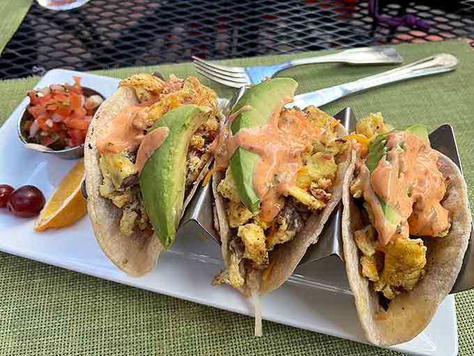 Behold the breakfast tacos that launched a thousand return visits, loaded with eggs, meat, potatoes, and that magical sriracha aioli.