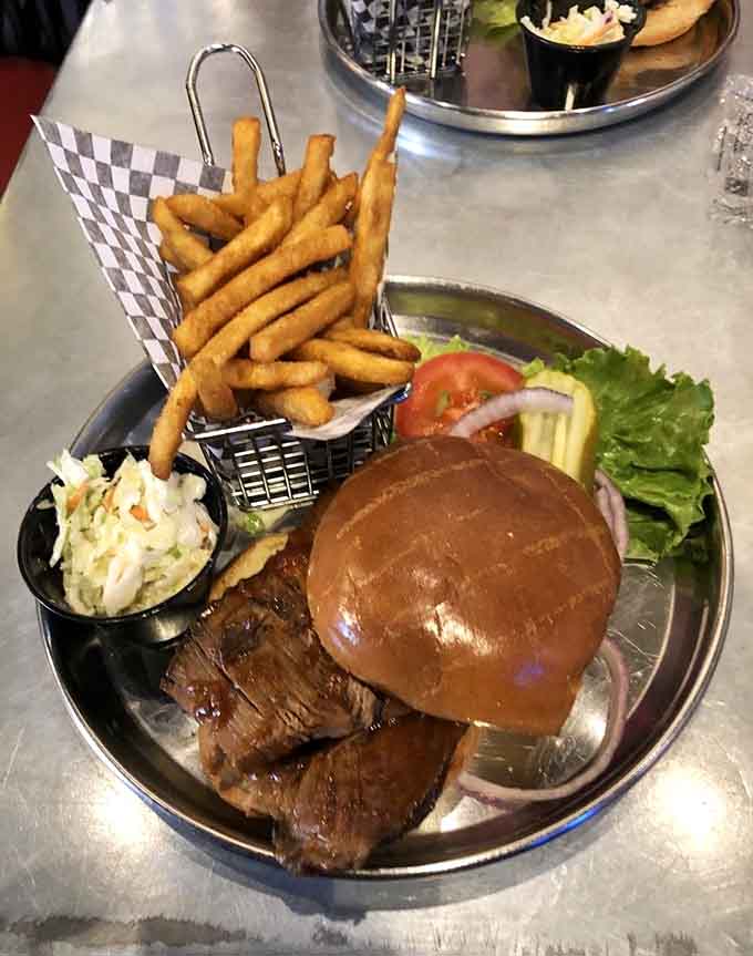 Behold the star of the show: tender, smoky brisket piled high with crispy fries that could make a grown person weep.