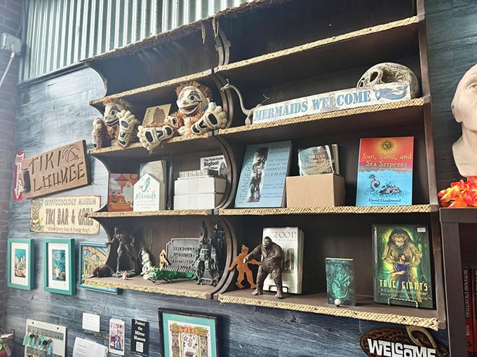 Shelves lined with cryptid literature and figurines showcase how deeply these mysterious beings have burrowed into our cultural imagination.