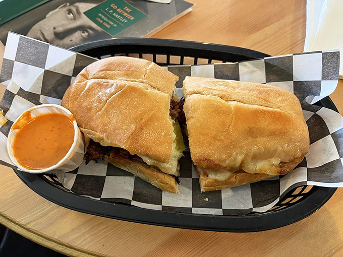 This Cuban sandwich isn't just food &ndash; it's architecture, with layers of slow-roasted pork, ham, and Swiss cheese creating the perfect harmony between crispy exterior and melty interior.