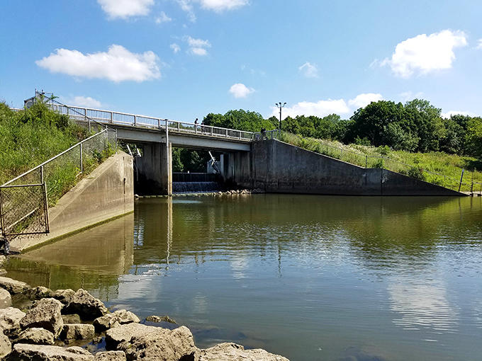 The dam stands as a testament to human engineering amid natural splendor, controlling water flow while creating scenic vistas.
