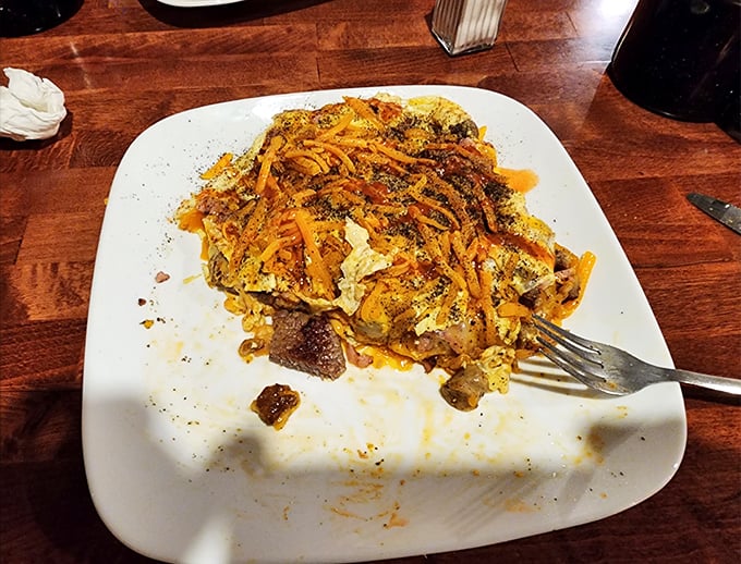 Breakfast demolition in progress! This loaded omelet might just be worth planning your entire vacation around.