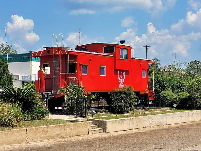 This vibrant red caboose stands as a cheerful reminder of DeFuniak Springs' railroad heritage &ndash; all aboard for nostalgia!