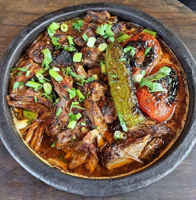 Konya Kebab arrives sizzling in its earthenware pot, the tender lamb practically begging you not to share it.