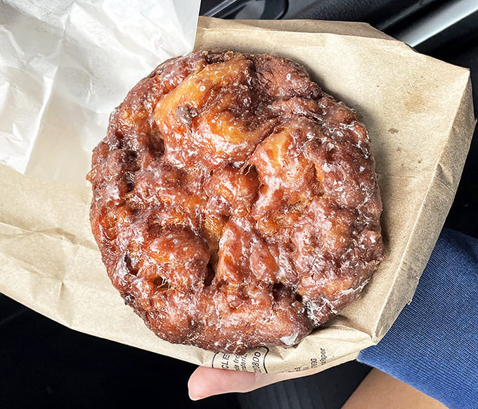 Apple Fritter: Behold the heavyweight champion of fritters &ndash; irregular, magnificent, and glistening with glaze that crackles between your teeth like edible music.