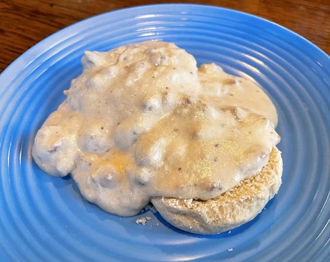 Behold the fluffy biscuit throne, crowned with sausage gravy so good it should require a permission slip from your doctor before ordering.