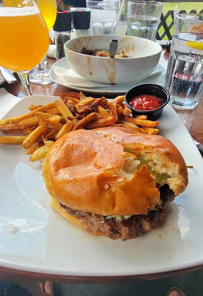 The Angus burger arrives like a work of art, with melted cheese cascading down sides that would make Niagara jealous.
