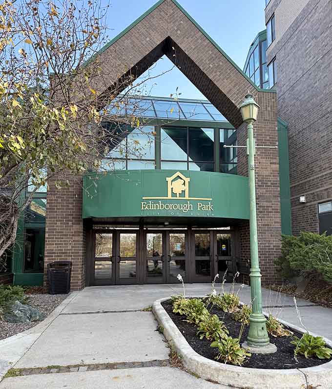 The entrance welcomes families with that distinctive green-and-brick aesthetic that screams "Minnesota nice" louder than a hotdish at a potluck.
