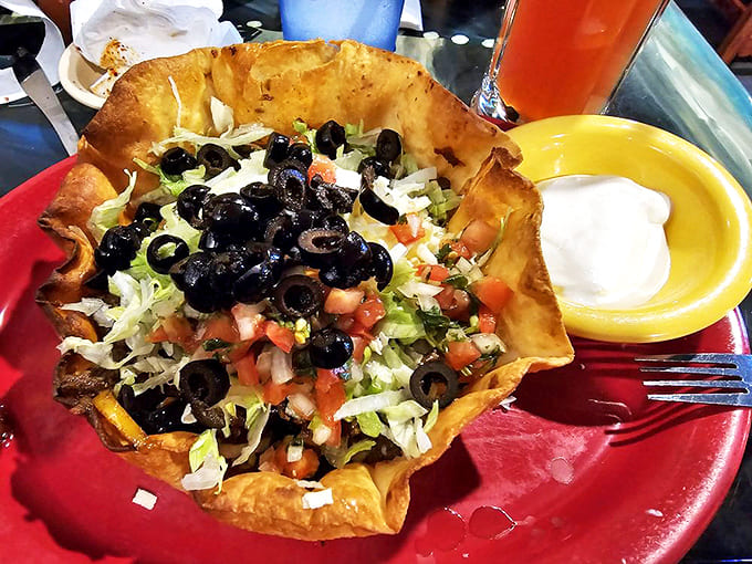 Fajita Steak Taco Salad: Who needs a boring salad when you can have this crunchy tortilla bowl filled with seasoned meat, fresh veggies, and those glorious black olives?