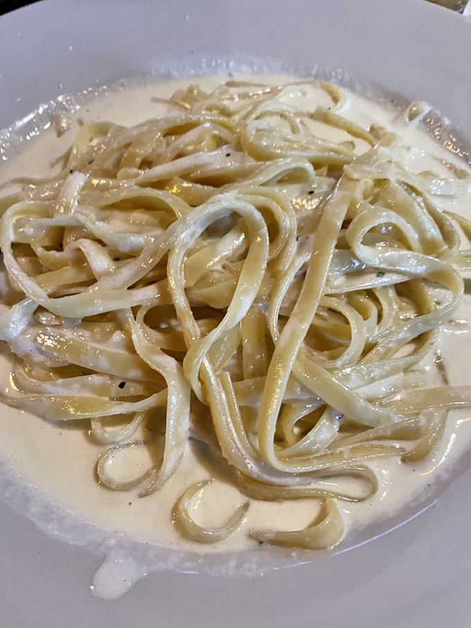This fettuccine Alfredo isn't just pasta&mdash;it's a silky, creamy masterpiece that makes you wonder if they've hidden an Italian grandmother in the kitchen.