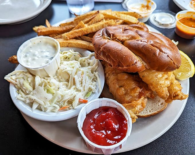 Golden-fried perfection nestled in a soft bun with creamy coleslaw &ndash; a sandwich that makes time stand still with each bite.