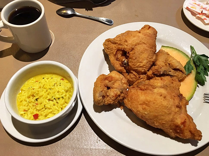 Golden-fried chicken paired with sunny yellow rice &ndash; a simple combination elevated to art form through perfect execution and generous portioning.