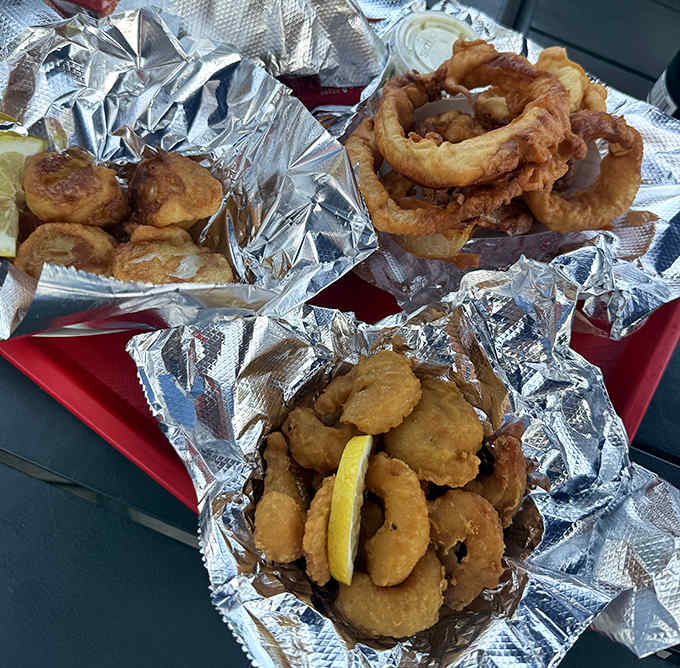 Golden-fried scallops nestled in foil – these crispy-on-the-outside, tender-on-the-inside treasures are worth every minute spent in line.