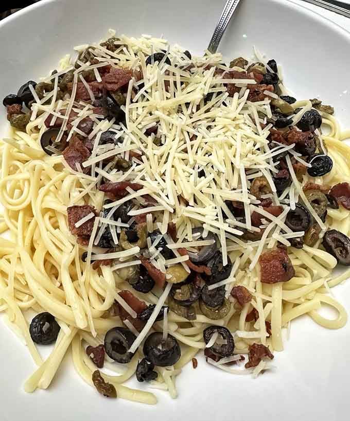 Greek Spaghetti loaded with olives and cheese, proving that Mediterranean flavors and Italian pasta can absolutely be best friends forever.