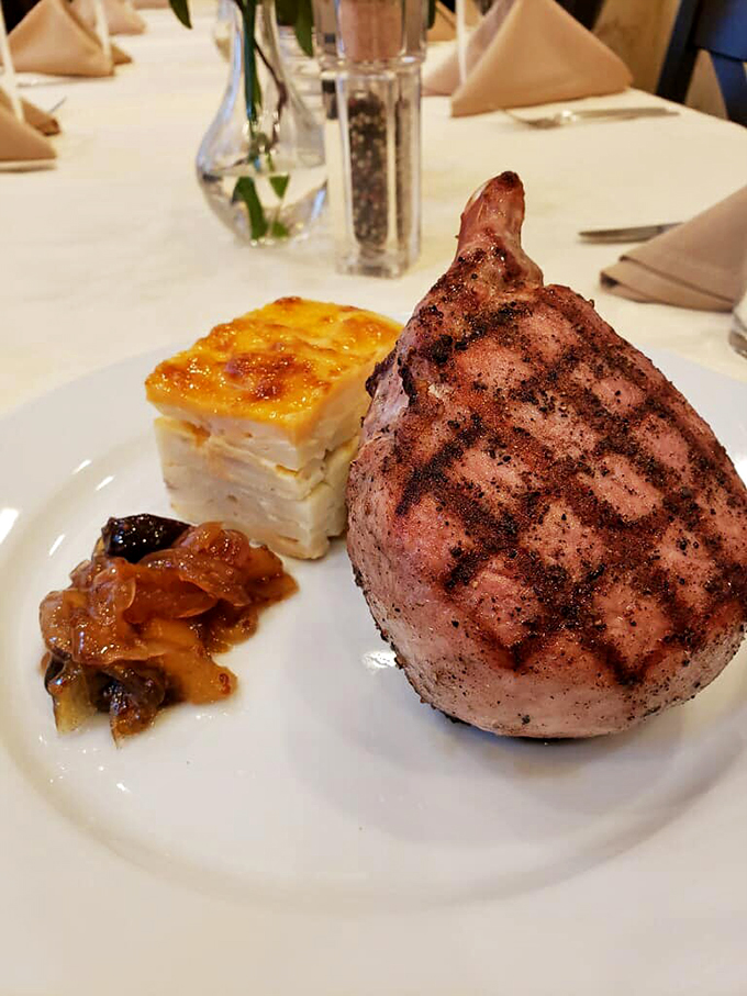 Behold, the pi&egrave;ce de r&eacute;sistance! This pork chop isn't just a meal but a meaty masterpiece that will make your mouth water.