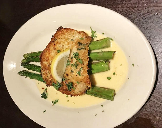 This isn't just fish&mdash;it's halibut transformed into art, with crispy coating and tender flesh playing a delicious duet with asparagus.