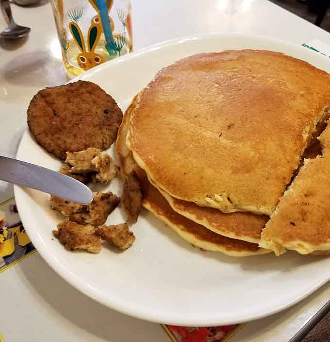 These golden pancakes stack up like edible architecture, fluffy enough to make clouds jealous and ready for syrup.