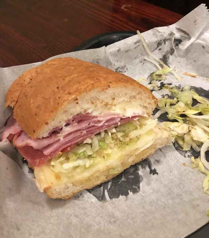 Behold the hoagie in all its glory, stuffed with layers of meat, cheese, and vegetables that somehow all work together in perfect harmony.