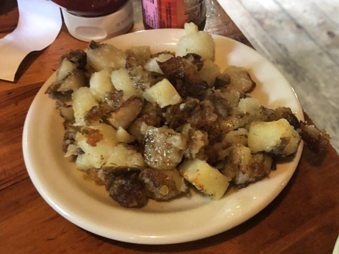 Home fries that will haunt your dreams &ndash; crispy exterior, fluffy interior, and seasoned with what can only be described as potato magic.