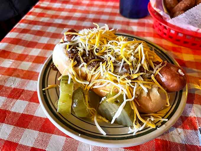 The Hungarian Hot Dog arrives like royalty &ndash; crowned with cheese, nestled alongside pickles, and ready to change your definition of comfort food.