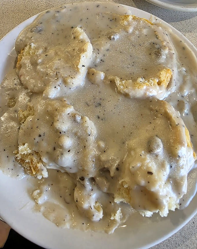 Biscuits drowning in peppery gravy that could convince anyone to become a morning person, at least temporarily for this plate.