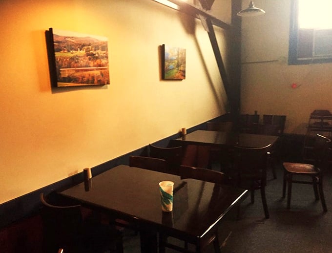Simple wooden tables and local artwork create the perfect backdrop for your lunchtime escape from the ordinary.