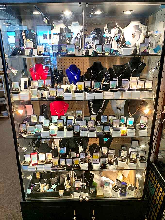 A dazzling array of vintage jewelry sparkles under glass, each piece whispering stories of special occasions and bygone fashion eras.