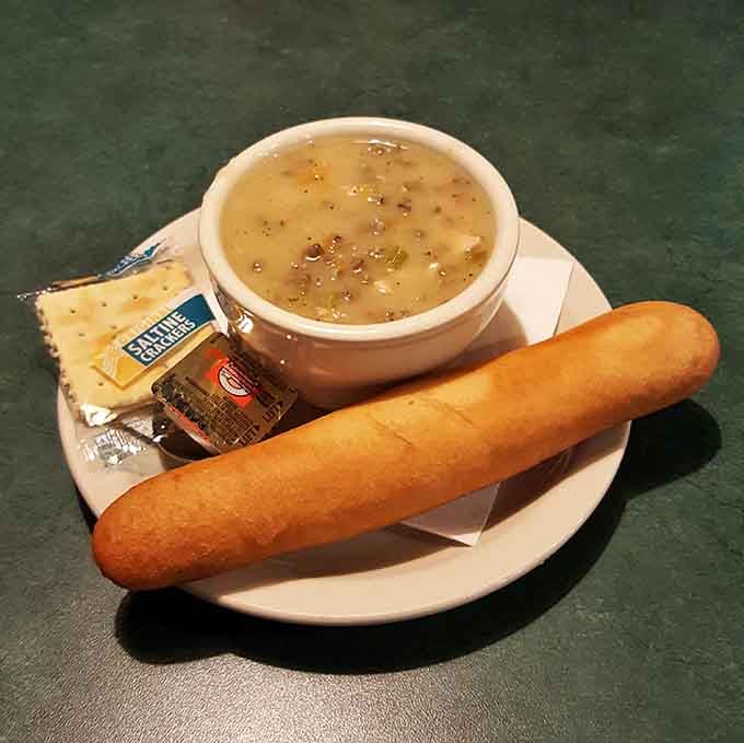 Behold the legendary Wild Rice Soup with its golden breadstick sidekick, ready to warm your soul one creamy, nutty spoonful at a time.