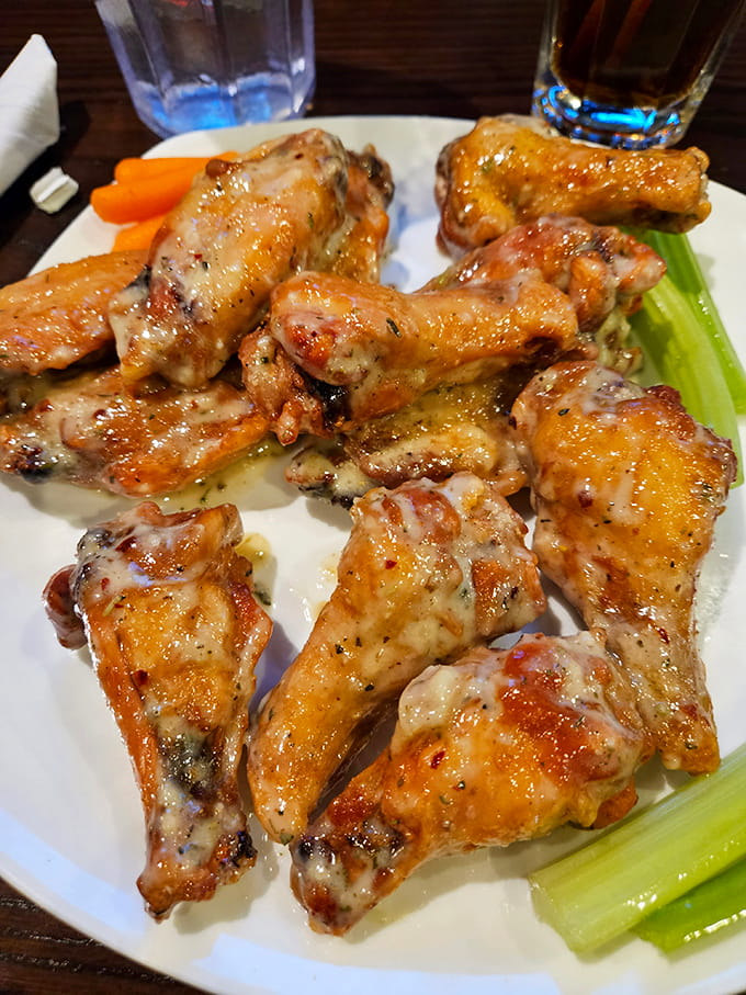 Golden, glistening, and generously coated in garlic parmesan perfection, these wings are what dreams are made of, assuming you dream about poultry.