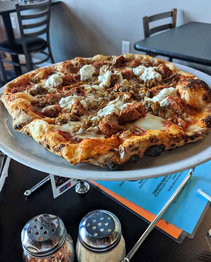 Behold the lasagna pizza in all its glory, where Italian comfort food meets wood-fired perfection and nobody has to choose between favorites anymore.