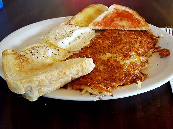 Behold the golden perfection of Judy's famous hashbrowns alongside perfectly cooked eggs, a combination that has launched a thousand return visits and counting.
