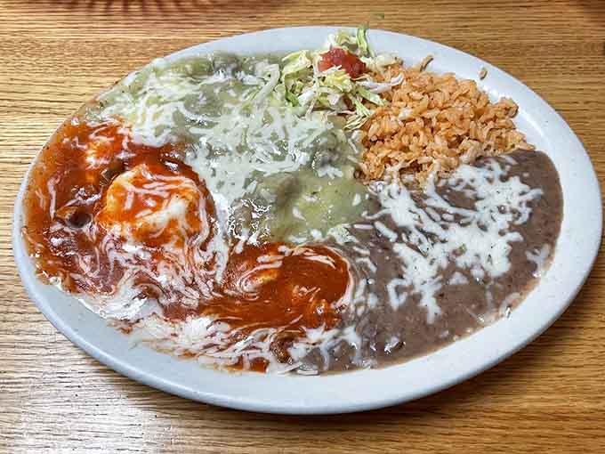 Huevos rancheros done right, with eggs, beans, rice, and enough sauce to make your morning infinitely better than it was five minutes ago.
