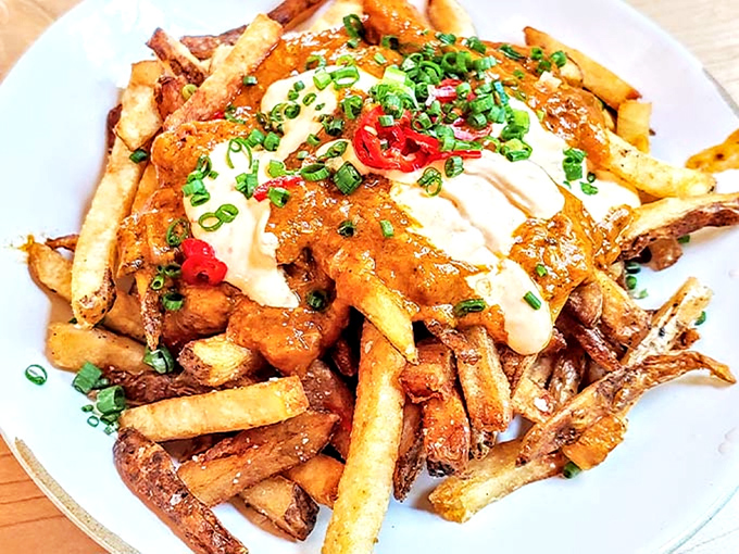 Golden fries crowned with savory toppings and fresh scallions. A fork-worthy indulgence that redefines "loaded" with every bite.