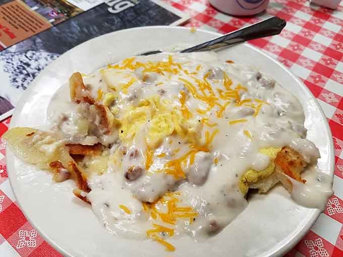 Behold the main event: fluffy biscuits swimming in peppery sausage gravy that could make a grown person weep with joy.