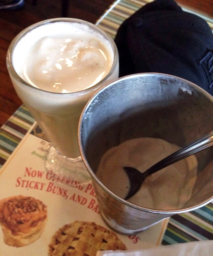 That's not just a milkshake &ndash; it's a life decision in a glass. The metal mixing cup on the side is the caf&eacute;'s way of saying "we got you."