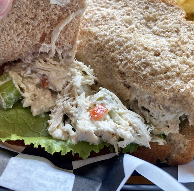 Behold the legendary chicken salad sandwich, where tender chicken meets secret seasonings in a combination that's launched a thousand return visits.