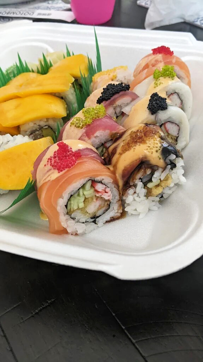 Nigiri Deluxe Like a jewelry box filled with oceanic treasures, each piece of nigiri sits perfectly arranged, topped with colorful roe and delicate garnishes.