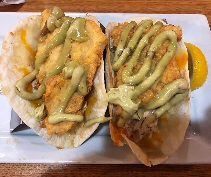Golden-fried haddock topped with that gorgeous green aioli drizzle makes these tacos absolutely irresistible.