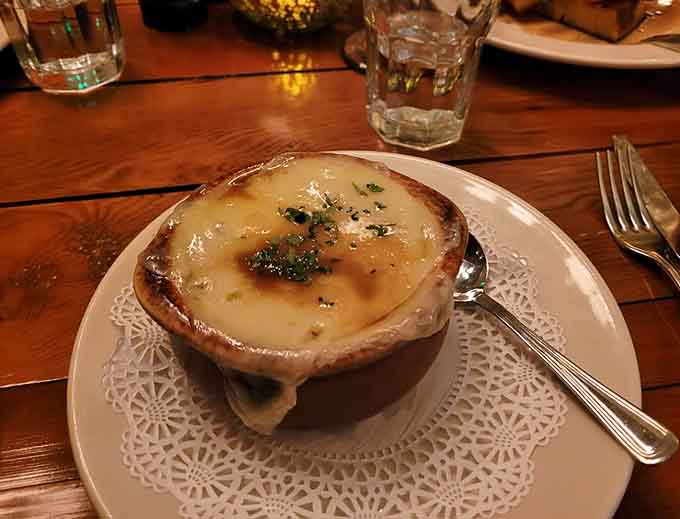 The French onion soup that's achieved legendary status, complete with that gloriously melted cheese blanket you'll dream about for weeks.