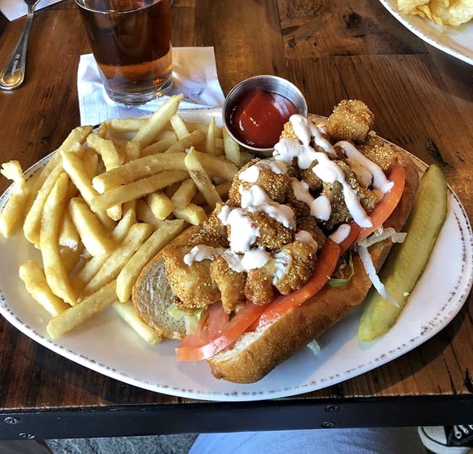 Behold the famous catfish po'boy, golden and crispy, accompanied by perfectly seasoned fries that deserve their own fan club.