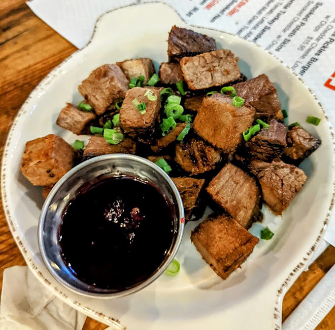 BBQ burnt ends so tender they practically dissolve on your tongue, proving patience is delicious.