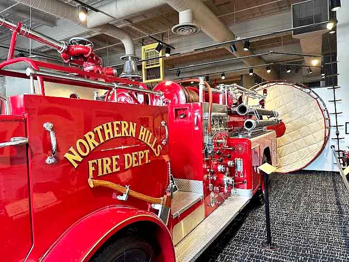 Northern Hills Fire Dept Engine: Vibrant red paint and gold lettering showcase an era when even utilitarian vehicles were designed with an artist's eye.