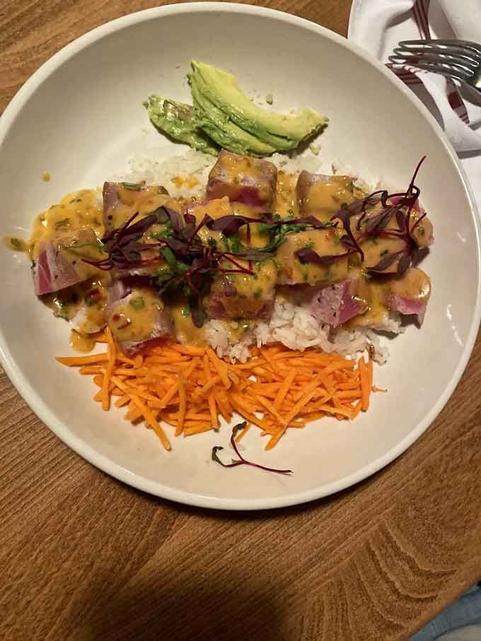 The seared rare tuna is a masterpiece of color and flavor, proving that exceptional seafood isn't just for coastal cities.