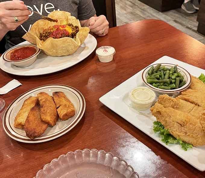 This spread of walleye, taco salad, and wedges proves that good things come in generous portions to those who follow signs.