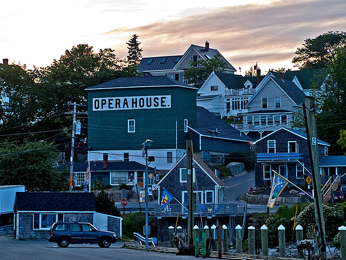 The historic Opera House stands as Stonington's cultural anchor, its green fa&ccedil;ade a beacon for arts and entertainment since 1912.