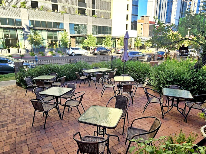 Dine al fresco in this urban oasis. It's like your backyard patio got a fancy makeover, complete with a view that beats watching the neighbors mow their lawn.