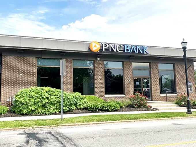 PNC Bank's clean lines and landscaped entrance offer modern banking services while respecting the town's architectural character.
