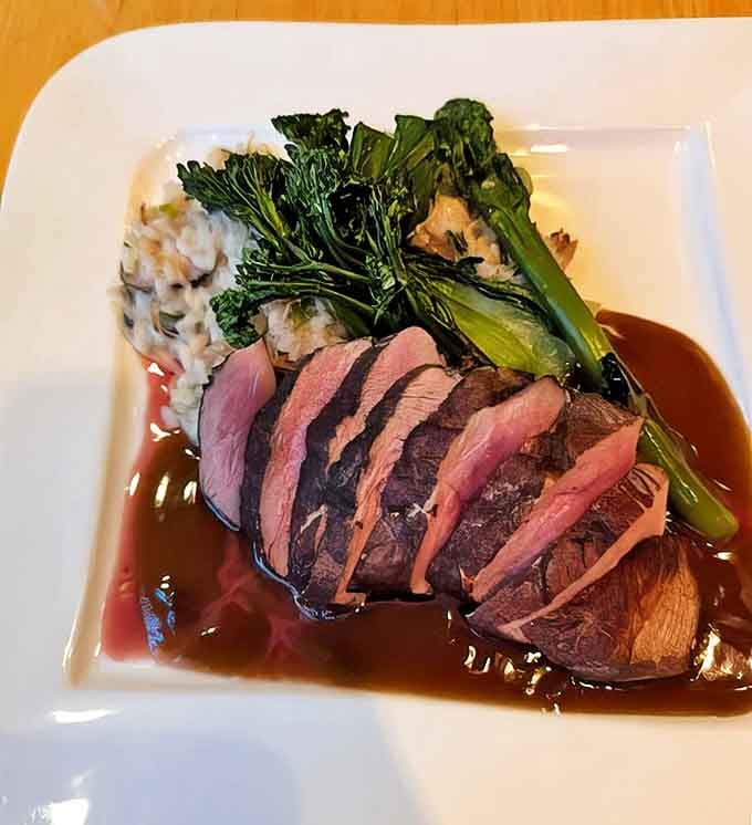 The legendary Five-Spice Duck arrives like culinary royalty &ndash; perfectly pink, surrounded by vibrant greens, and bathed in a sauce worth bottling.